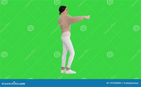 Pretty Brunette Taking A Selfie On A Green Screen Chroma Key Stock