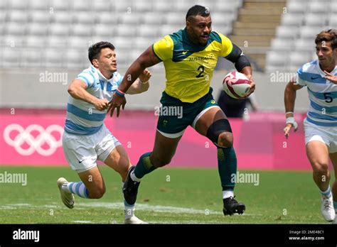 Australias Samu Kerevi Center Runs With The Ball Chased By Australia