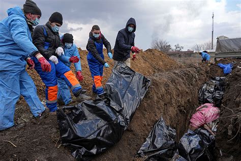 Bodies Buried In Mass Grave As Mariupol Endures Unrelenting Russian Assault