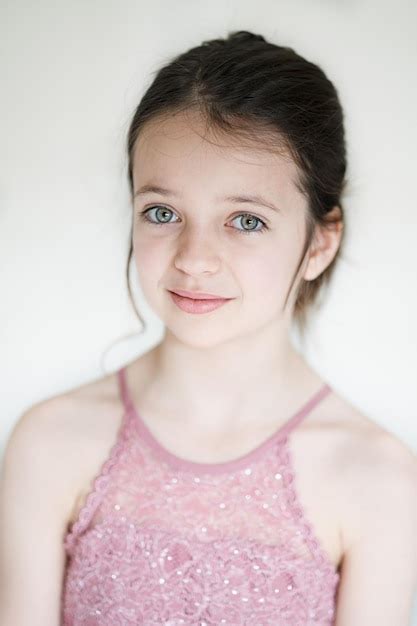 Premium Photo Close Up Portrait Of Smiling Girl Against White Background