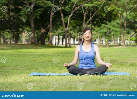 A Pleasure Woman Closed Eyes Sitting On Yoga Matt Doing Yoga In The