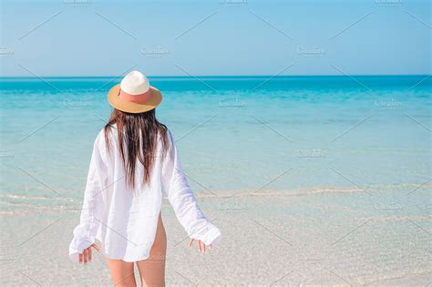Woman Laying On The Beach Enjoying S Featuring Beach Vacation And