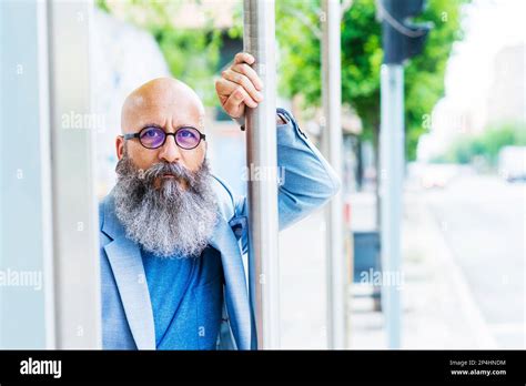 Hispanic Middle Aged Bald Bearded Bearded Man Standing Leaning On