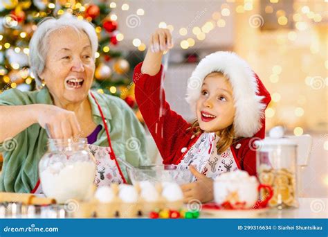 Grandma And Granddaughter Spend Christmas Evening Cooking Ginger