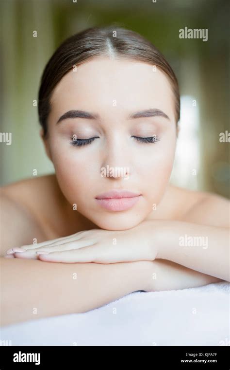 Relaxed Woman With Closed Eyes Having Massage Of Her Body In Spa Salon