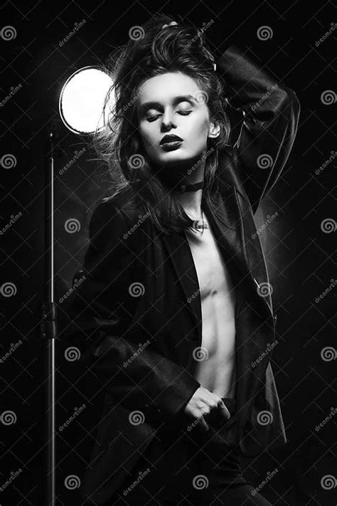 Beautiful Braless Girl With Red Lips Wearing An Unbuttoned Black