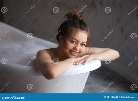 Water Treatment Smiling Brown Haired Woman Leaning On The Edge Of