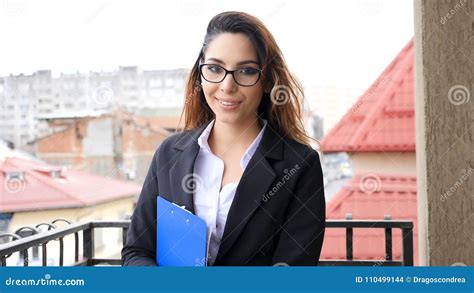 Beautiful Brunette Woman In Business Suit Smiling To The Camera Stock