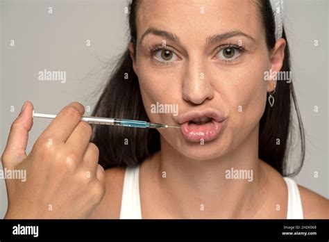 Portrait Of A Young Beautiful Woman On A Lip Filler Self Injection