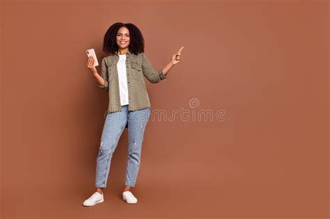 Full Length Photo Of Cute Millennial Brunette Lady Hold Telephone Point