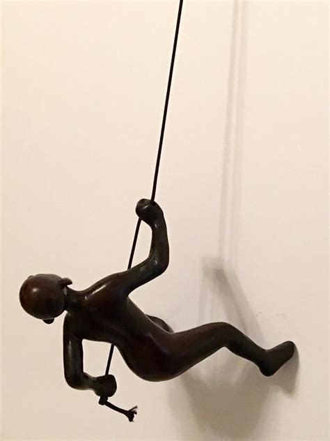climbing man wall sculpture