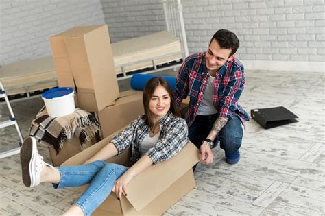 Premium Photo Happy Couple Having Fun Laughing Moving Into New Home