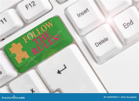 Conceptual Hand Writing Showing Follow The Rules Business Photo
