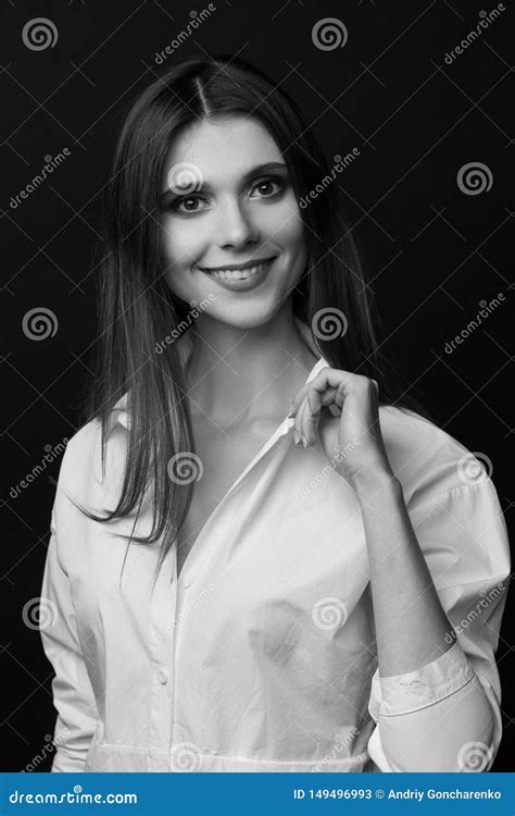 Black And White Portrait Of A Beautiful Woman In A White Shirt On A