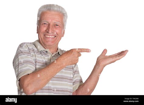 Portrait Of Senior Man Showing Something On White Background Stock