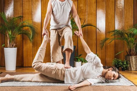 Premium Photo Thai Yoga Massage Passive Halflocust Stretches