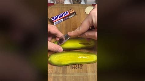 people are eating snickles made of snicker stuffed pickles in