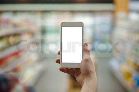 Man Holding Mobile Phone And Showing Display To Camera Stock Image