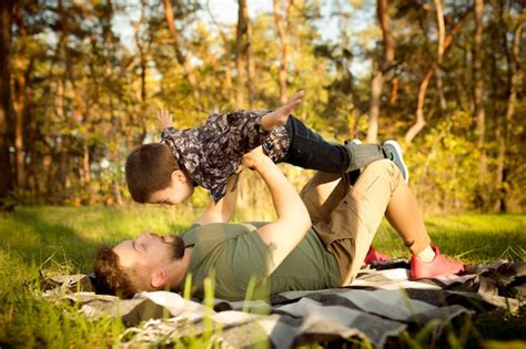 Premium Photo Father And Son Walking And Having Fun In Autumn Forest