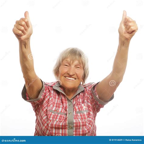 Happy Senior Woman Giving Two Thumbs Up As Sign Of Approval Stock