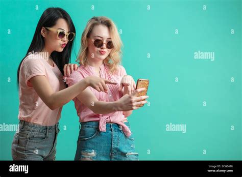 Attractive Thai Teenager Girl In Denim Shorts Making Duck Face While