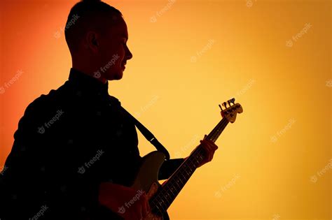 Premium Photo Silhouette Of Young Caucasian Male Guitarist Isolated