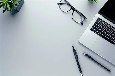 Workplace With Laptop Glasses And Pen View From Above Premium Ai