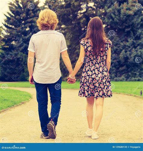 Man And Woman Holding Hands In Park Stock Image Image Of Holding