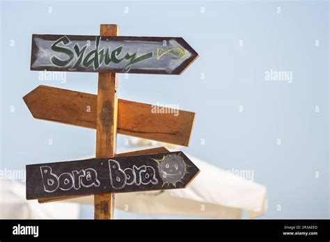 Wooden Pointer Post With Copy Space At The Beach Arrows On A Guidepost
