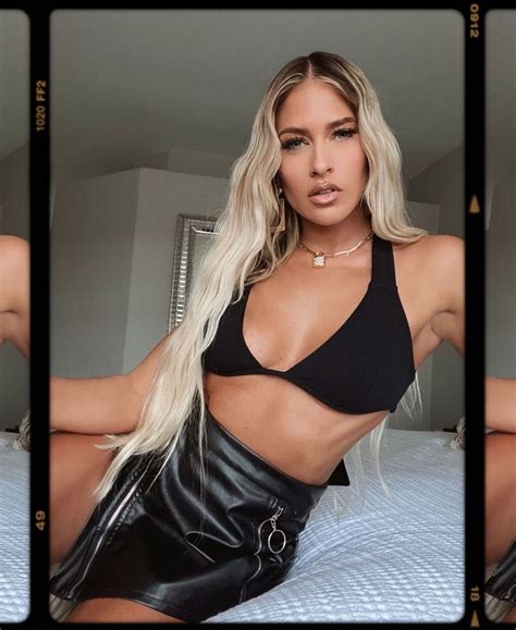 Wwe Legend Kelly Kelly Poses In Black Bra And Leather Skirt To Promote