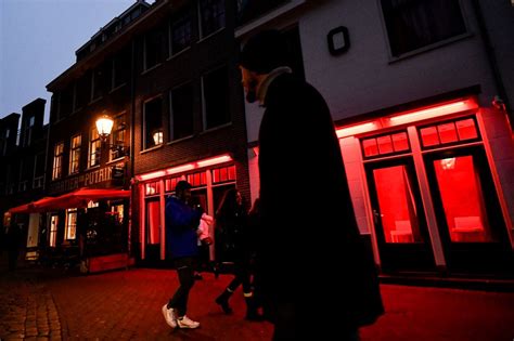 amsterdam looks to ban red light district sex workers from windows to