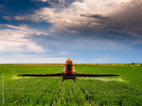 Tractor Applied Herbicides Pesticides And Fungicides In Wheat Fields