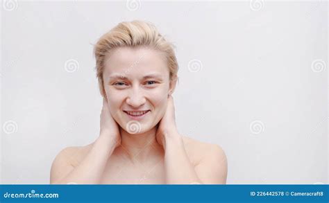A Beautiful Blonde Topless Model With Short Hair Hands Behind Her