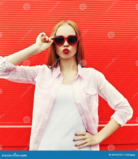 Pretty Woman In Red Sunglasses Blowing Lips Kiss Stock Image Image Of