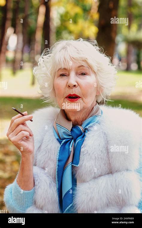 Smiling Senior Elegant Stylish Fashionable Woman With Grey Hair In Fur