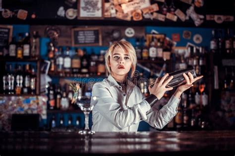 Professional Girl Bartending Adds Ingredients To A Cocktail In The Bar