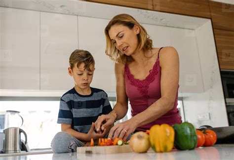 Mother And Son Cooking Together In Kitchen Photo 140349 Youworkforthem