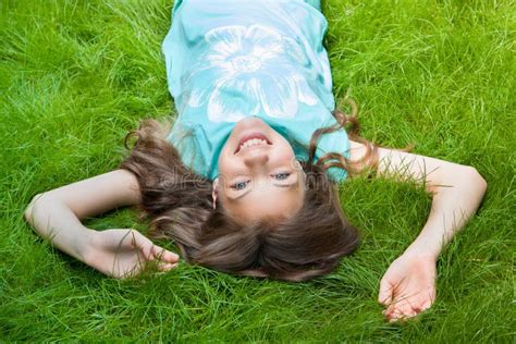 Pretty Teen Girl Lying On The Grass Laughter Joy Positive Emotions