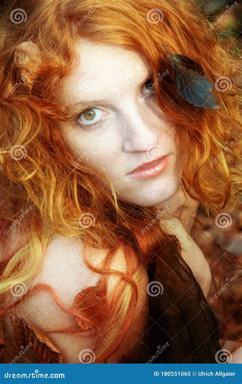 Portrait Of A Cute Young Lovely Redhead Girl With Autumnal Leaves