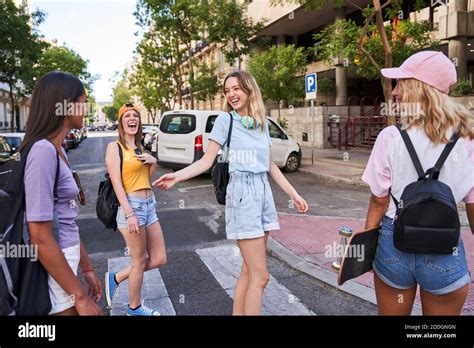 Group Of Cheerful Multiracial Teen Girls In Casual Clothes With
