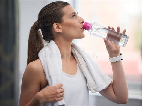 Fitness Woman And Drinking Water In Gym For Health Break And Energy