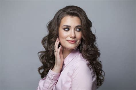 Gorgeous Woman With Long Healthy Wavy Hair Cute Smile And Make Up