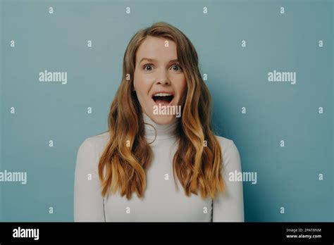 Positive Pretty Young Woman With Surprised Shocked Funny Facial