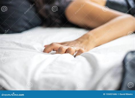 Man`s Hand Grabs Woman`s Hand Which Tries To Take Car Keys From Table