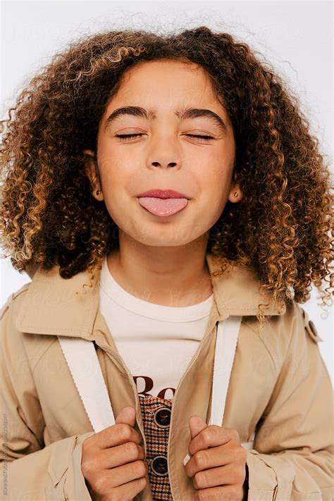 Portrait Of An Afro Hairstyle Girl By Stocksy Contributor