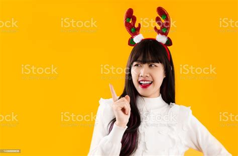 A Beautiful Asian Woman Long Hair In White Blouse Wearing Reindeer