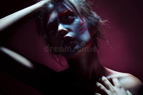 Fashion Portrait Of A Dark Skinned Girl With Silver Foil Make Up