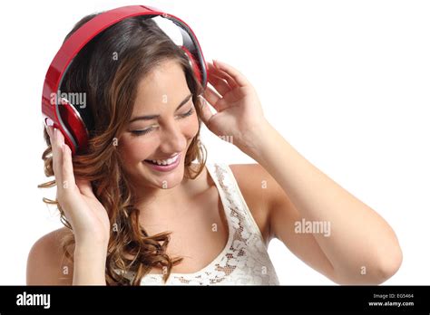 Young Happy Woman Enjoying Listening To The Music From Headphones