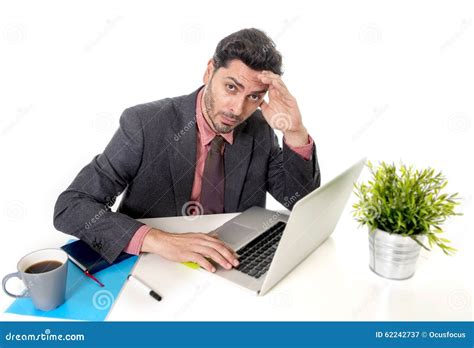 Attractive Businessman In Suit And Tie Working In Stress At Office