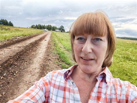 Funny Adult Girl Posing In Nature And Blue Sky On Background A Middle